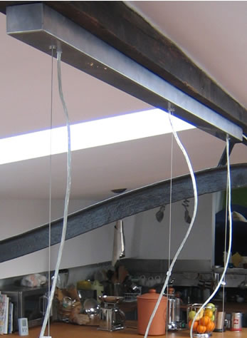 Multi-pendant design lights stainless steel and hanging fixture.