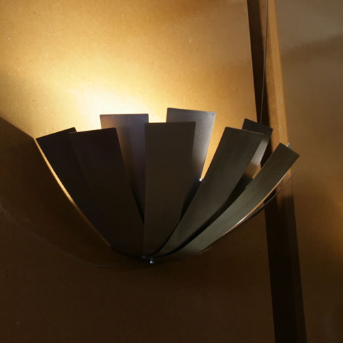 Design wall light directing light upward providing ambient light